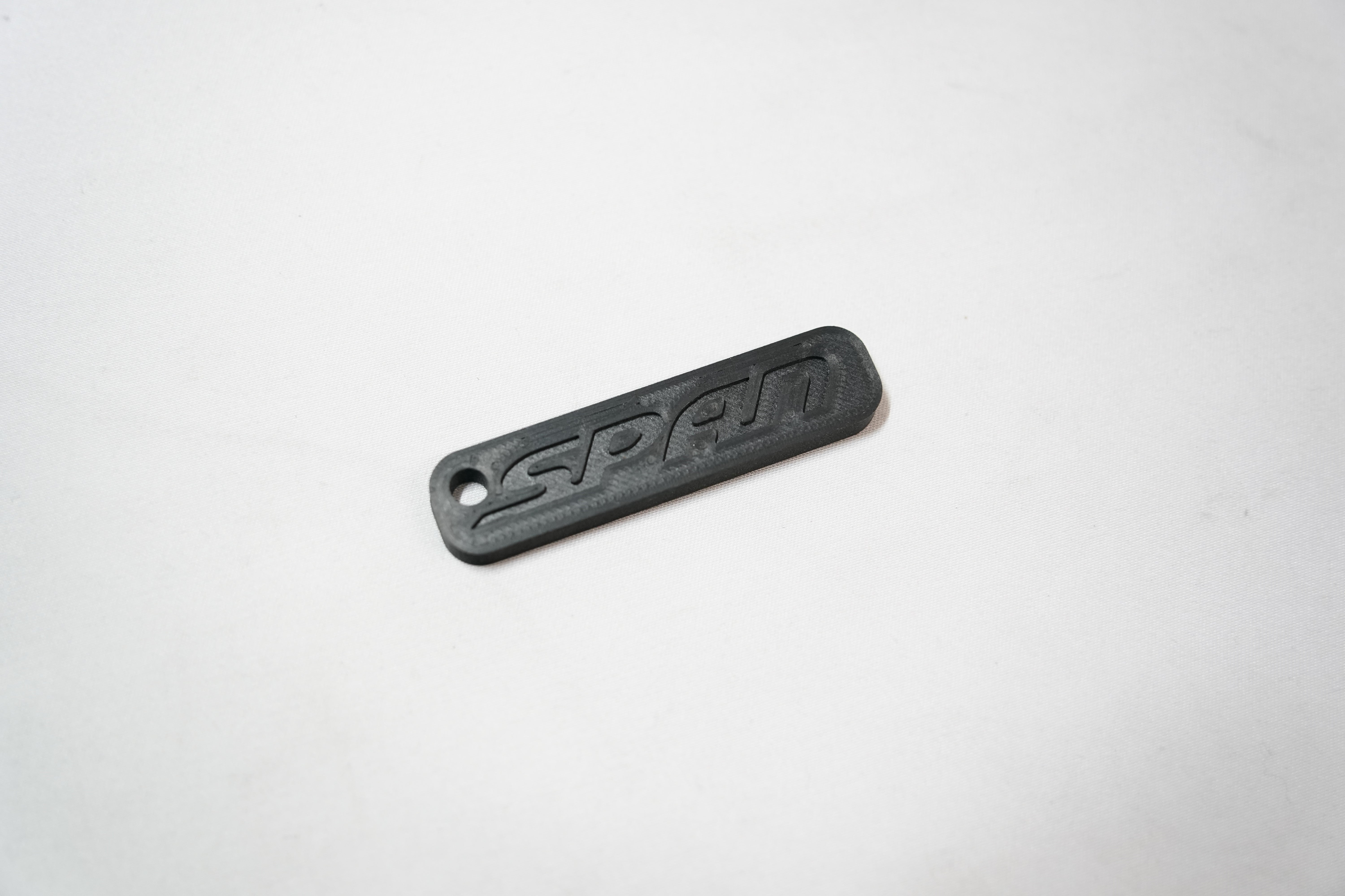 SPAN logo Keychain – SPAN Shop